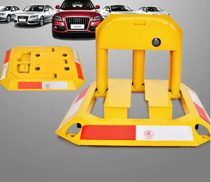 A yellow car parking blocker, designed to prevent unauthorized parking ...