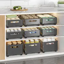 Elegant Pull-Out Spice Rack For Efficient Kitchen Storage And Organization.