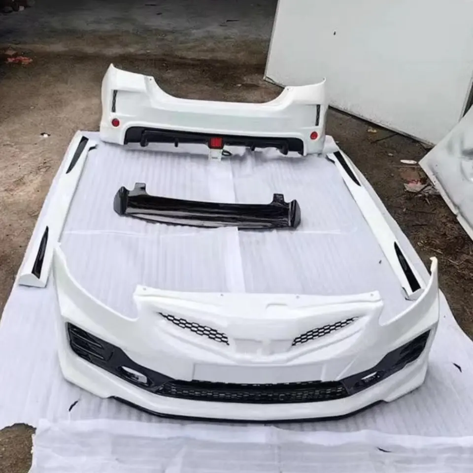 A body kit for a Honda Fit/Jazz, featuring a front and rear bumper ...